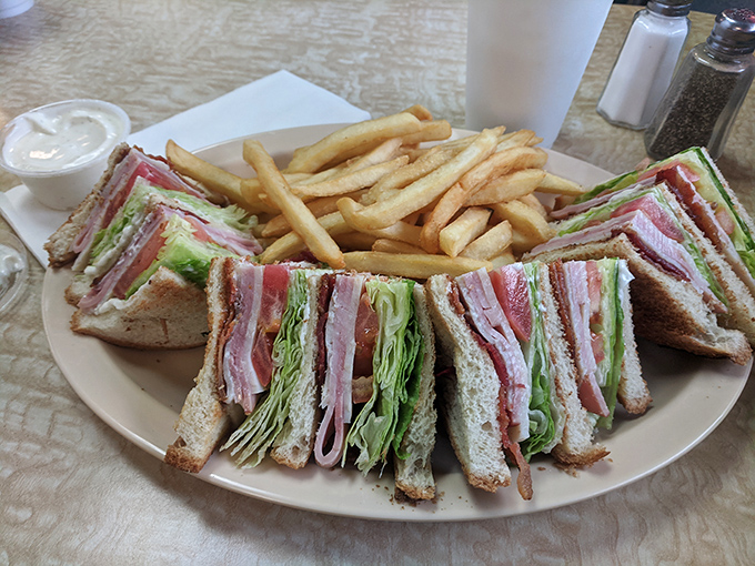 The club sandwich&mdash;triple-decker architecture that proves more is indeed more. Layers of meat, veggies, and toast create the skyscraper of sandwiches.