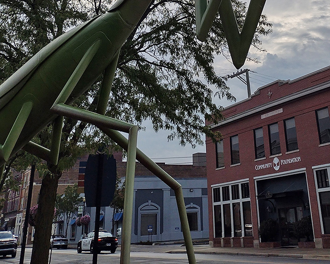 Downtown businesses have embraced their insect neighbor, proving that even Community Foundations are cooler with a giant mantis out front.