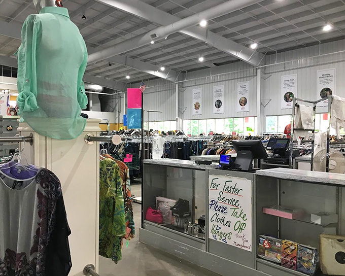 The checkout counter's gentle reminder that removing clothes from hangers speeds up the process. Efficiency meets thrift store wisdom.