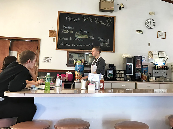 The counter where breakfast magic happens&mdash;where orders are called, coffee is poured, and the rhythm of small-town life plays out daily.