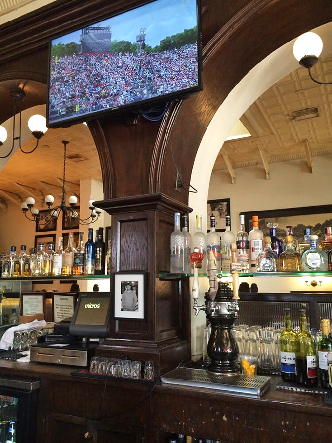 This cozy counter invites you to sit back with a drink while the game plays overhead, surrounded by vintage charm and good company.