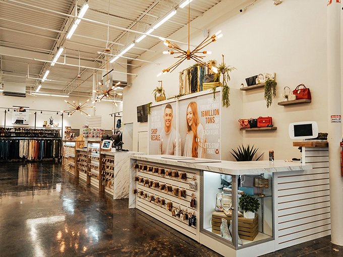 Clean, modern checkout area that says "fashion exchange," not "thrift store." Those copper light fixtures would cost a fortune at design shops!