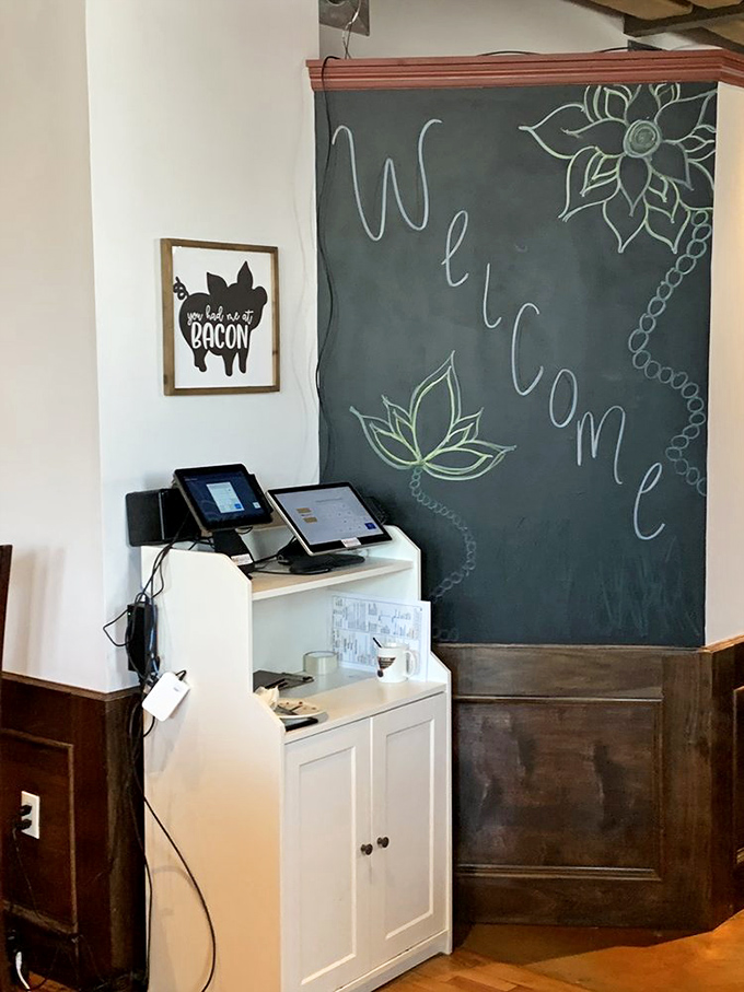 A welcome chalkboard that might as well say "Abandon all diets, ye who enter here" &ndash; with a pig sign that proudly endorses bacon consumption.