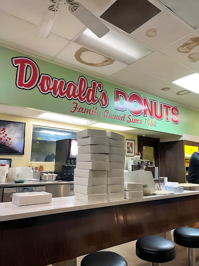 Behind this counter, donut artisans work their magic with flour, oil, and decades of experience.