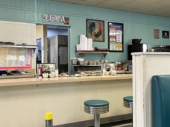 The counter area, complete with those classic turquoise stools, offers front-row seats to the behind-the-scenes magic and friendly banter with staff.