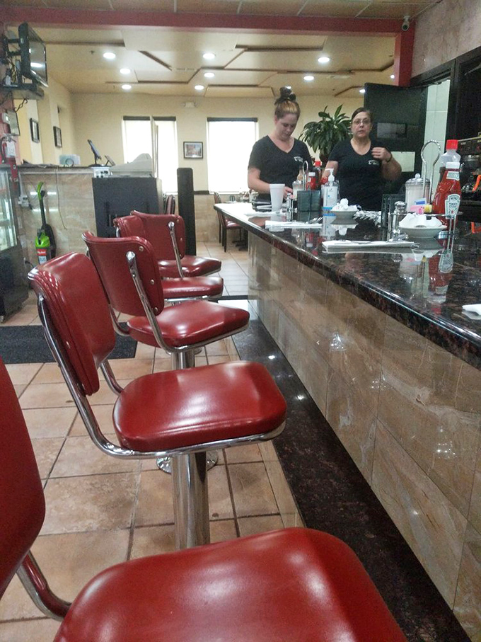 Counter seating: where solo diners become temporary family and coffee refills arrive before you even ask. The breakfast equivalent of front-row seats.