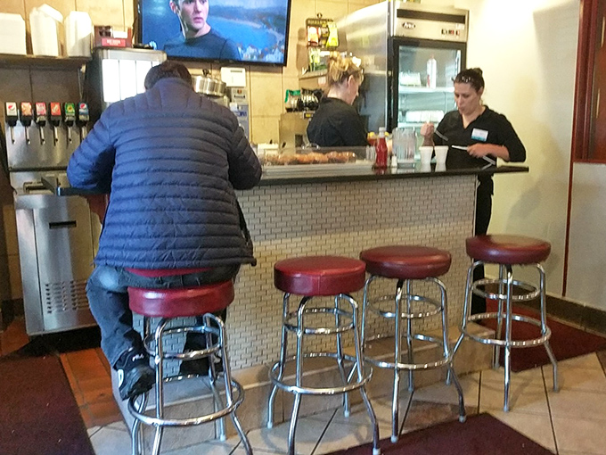 Counter seating: where solo diners become regulars and the coffee is poured before you even ask for it.