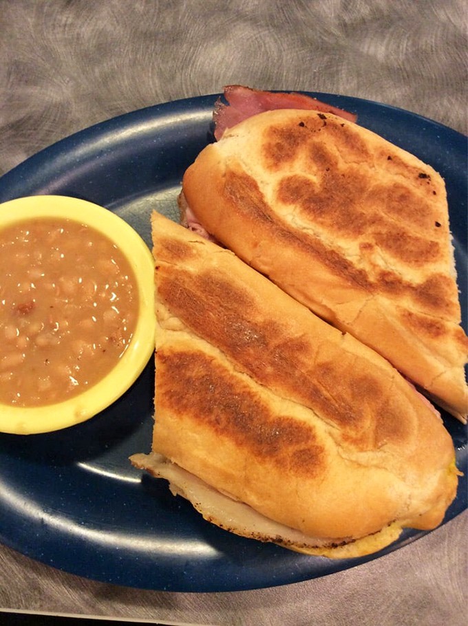A pressed Cuban sandwich with beans that makes you wonder if you've been eating sandwiches wrong your entire life.
