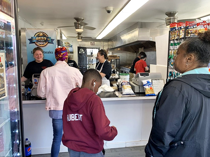 The lunch rush—a cross-section of Delaware County united in pursuit of sandwich perfection. Some things transcend all differences.