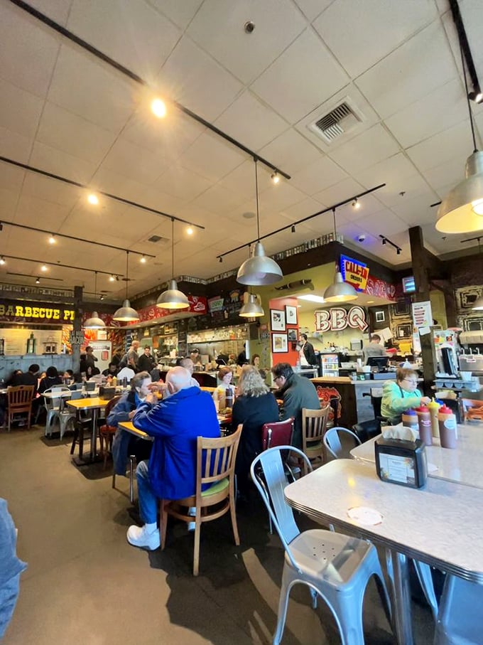 The dining room hums with the universal language of barbecue appreciation. Notice the absence of conversation—everyone's too busy eating.