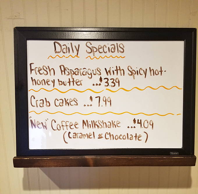 Daily specials board &ndash; where culinary adventures begin. Fresh asparagus with spicy honey butter? Yes, please!
