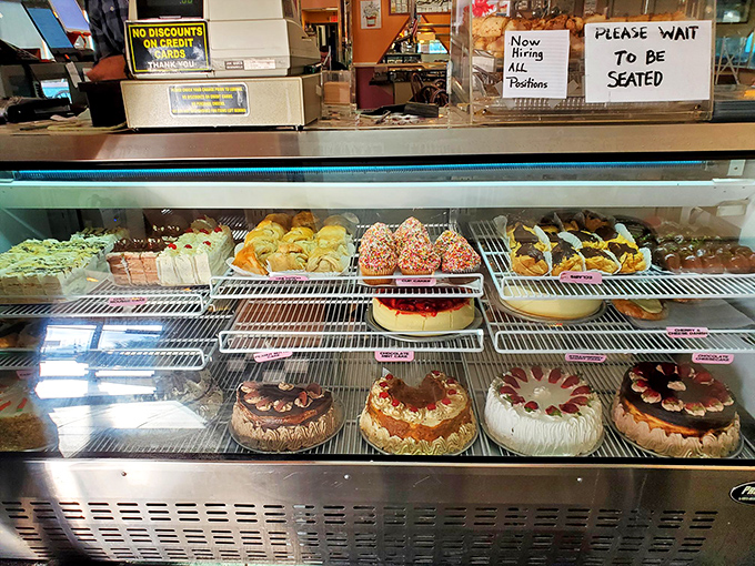The dessert case&mdash;a glass-fronted gallery of temptation where willpower goes to die. Those cakes aren't just desserts, they're life goals.