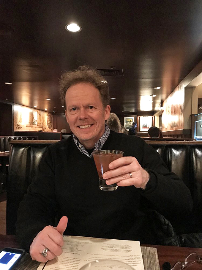 The universal expression of someone who's just discovered their new favorite restaurant: pure, unadulterated cocktail-sipping joy.