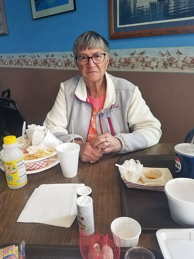 A patron enjoying the fruits of Captain Bob's labor. The true test of any restaurant is the satisfied look on diners' faces.