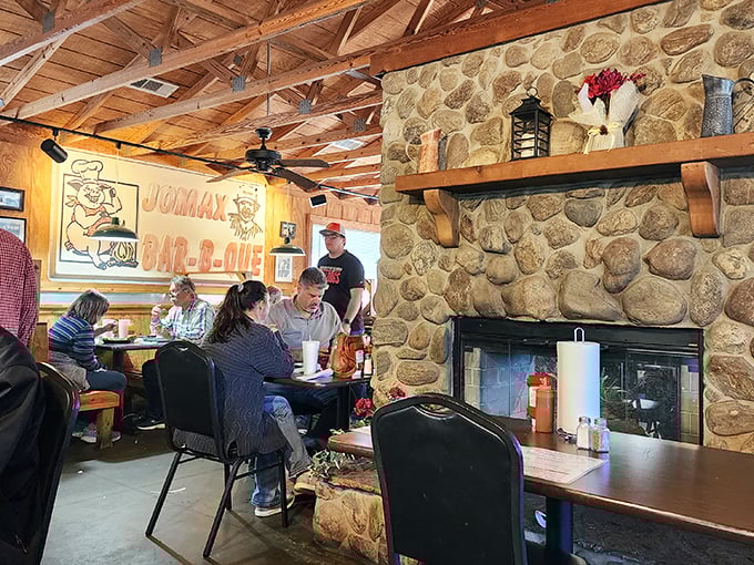 The stone fireplace and exposed wooden beams create the perfect backdrop for what truly matters: friends, family, and seriously good barbecue.