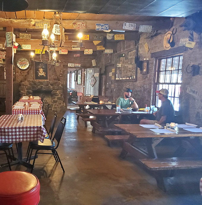 Conversations happen differently here, where wooden tables have heard decades of stories and the lighting forgives all sins except wasting good food.