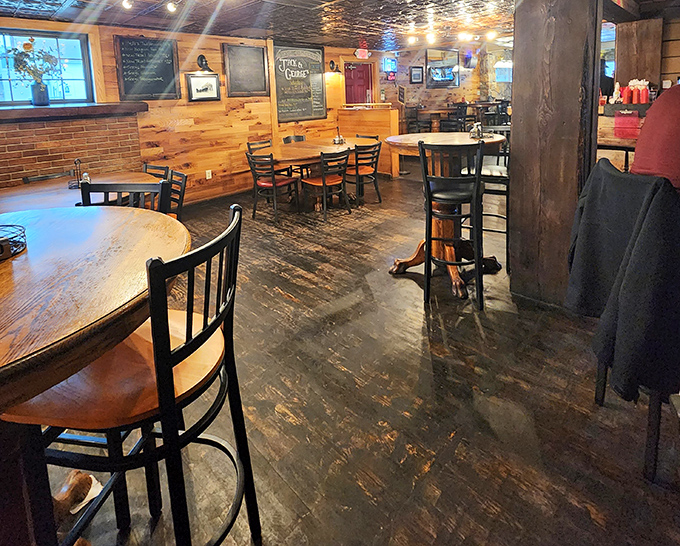 Wooden tables worn smooth by thousands of satisfied elbows—each scratch and mark a testament to meals thoroughly enjoyed.