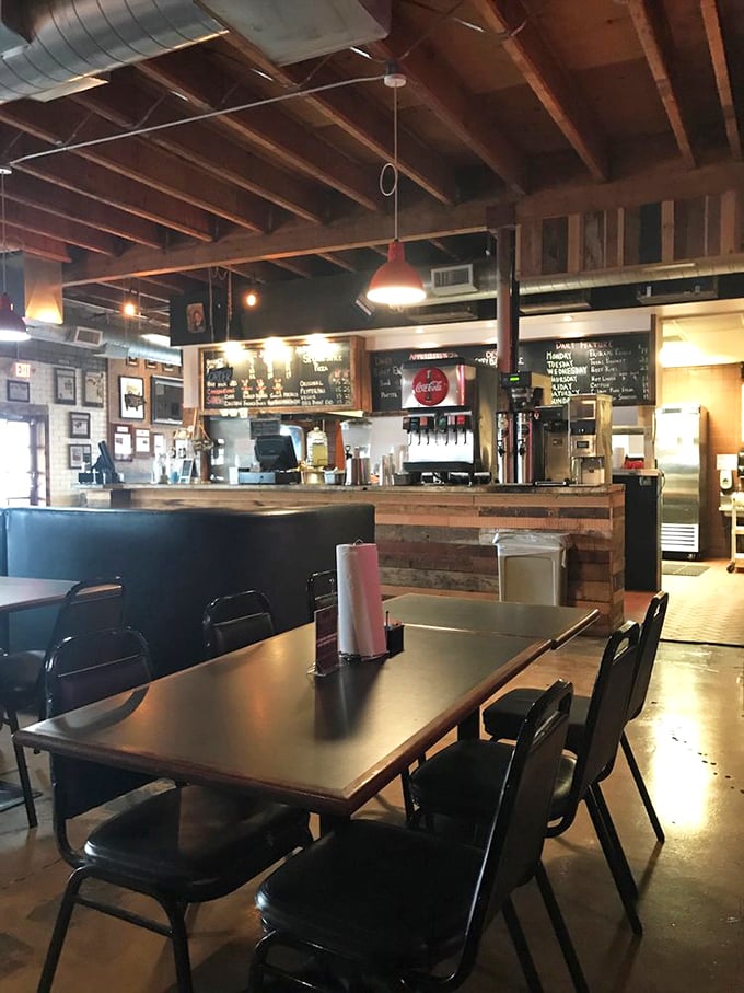 Simple tables, pendant lights, and the promise of barbecue bliss. The minimalist setting ensures nothing distracts from the star of the show.