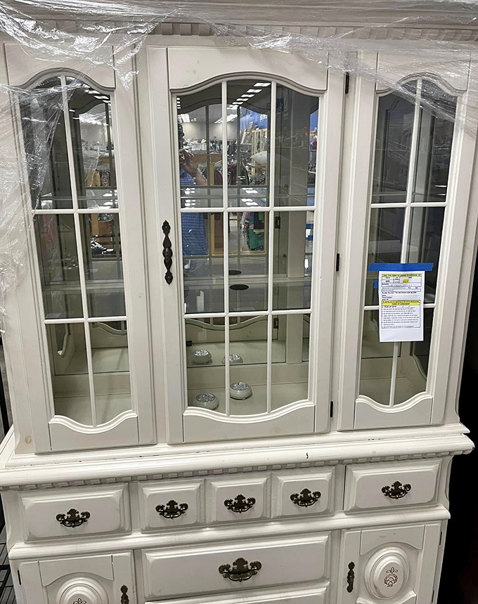 This elegant white display cabinet looks like it escaped from a Pottery Barn showroom. Perfect for displaying the treasures you'll find in other aisles!