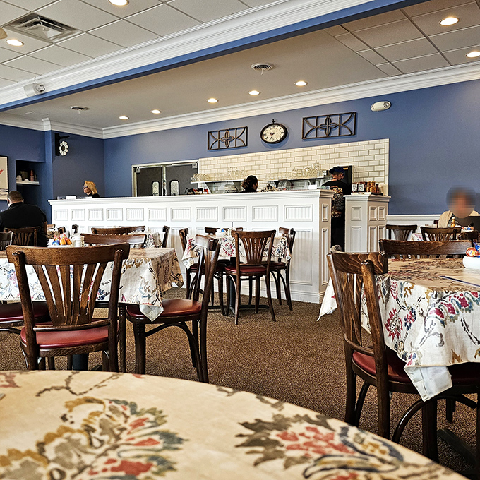 Where breakfast magic happens. The white wainscoting and blue walls create a backdrop for morning memories.