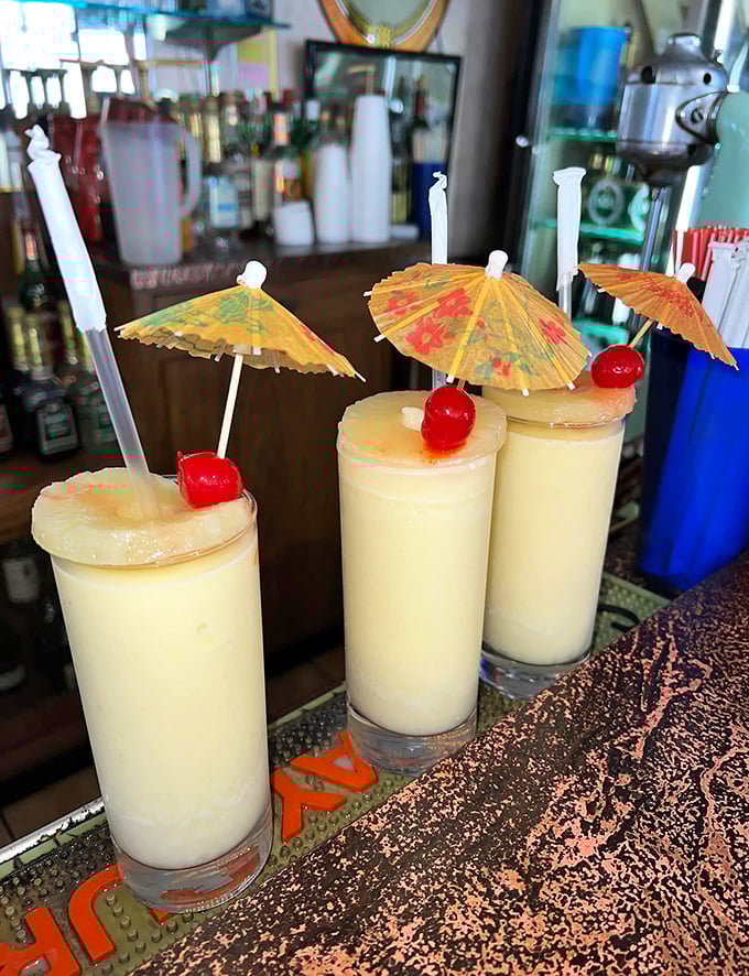 Pi&ntilde;a coladas with paper umbrellas and pineapple garnish&mdash;vacation in a glass, even if you're just on lunch break.