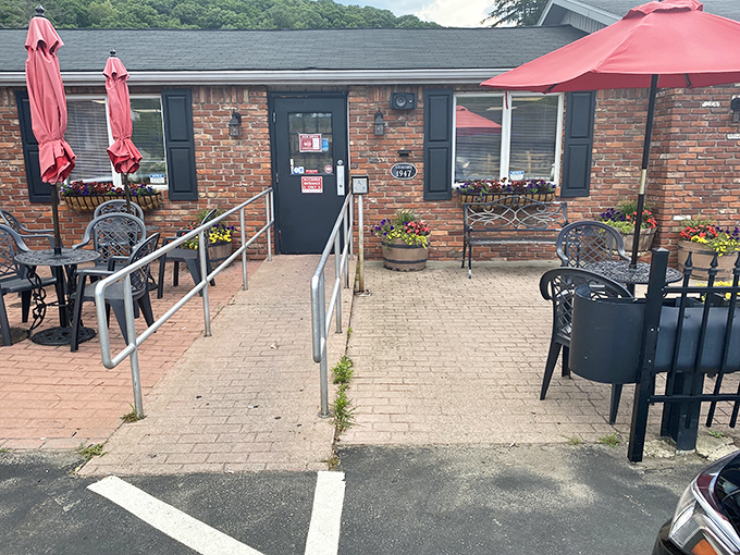 The entrance, adorned with colorful flower planters, says "Welcome to carb heaven" without needing a single word.