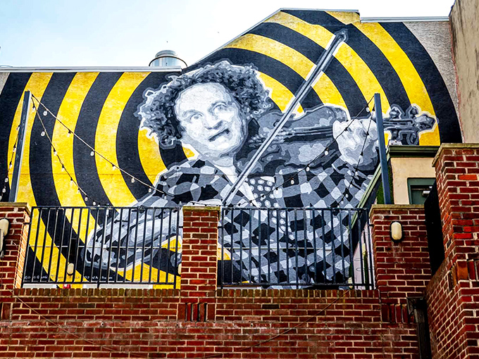This magnificent mural of Larry Fine playing violin reveals the surprising musical talent behind the wild-haired middle Stooge's on-screen antics.