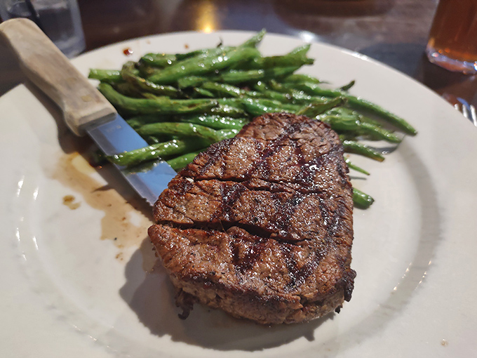 A perfectly cooked filet mignon with green beans that proves simple food done right is worth more than a thousand fancy foams and reductions.