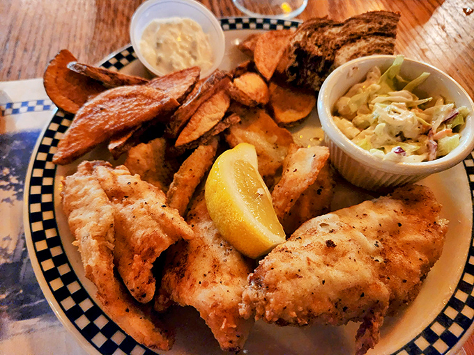 Friday fish fry perfection: crispy on the outside, tender within, and served with the kind of sides that make you forget counting calories.
