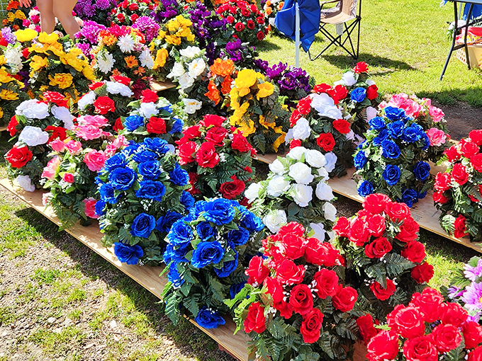 Fresh flowers add natural beauty to the commercial chaos, brightening spirits and vendor displays alike.