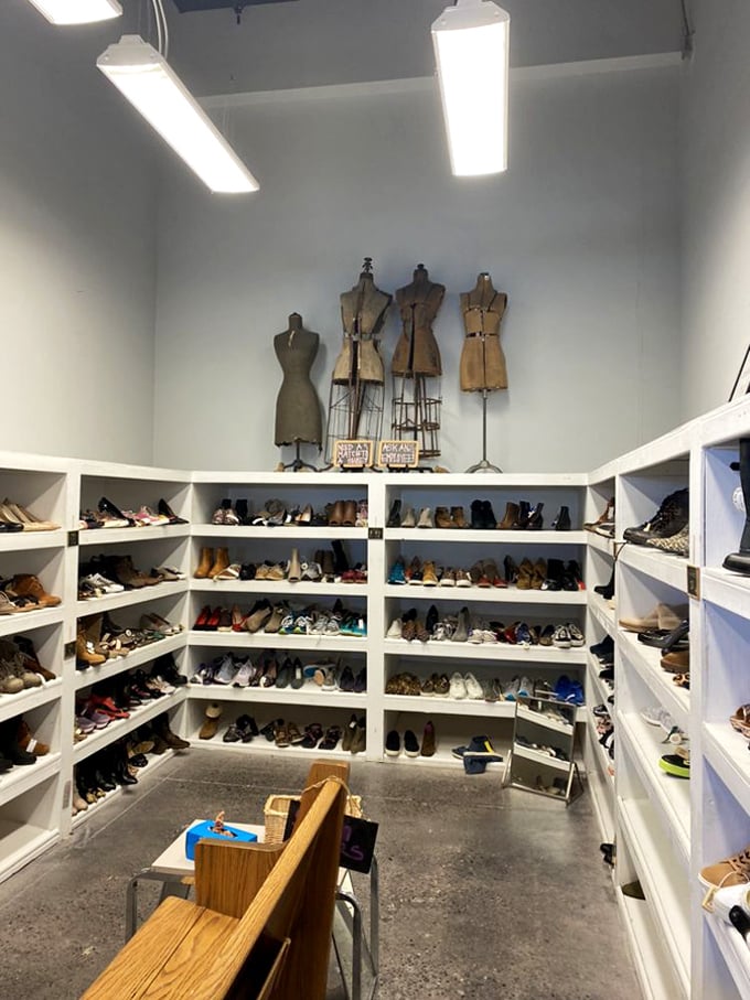 Shoe heaven awaits! Vintage dress forms stand guard over a meticulously organized footwear collection that could make even the most devoted collector pause in awe.
