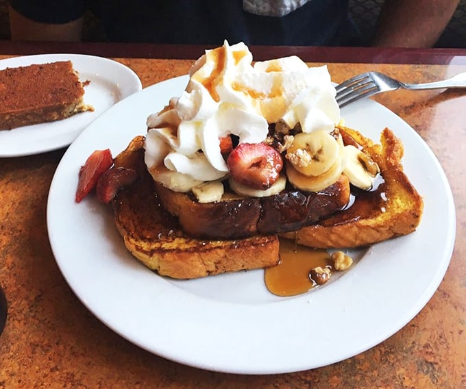 Decadent French toast topped with fresh fruit and whipped cream transforms breakfast into a celebration worth savoring.