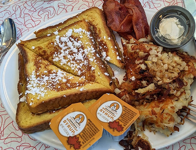 French toast dusted with powdered sugar, bacon cooked to perfection, and hash browns that achieve the elusive crispy-yet-tender balance.