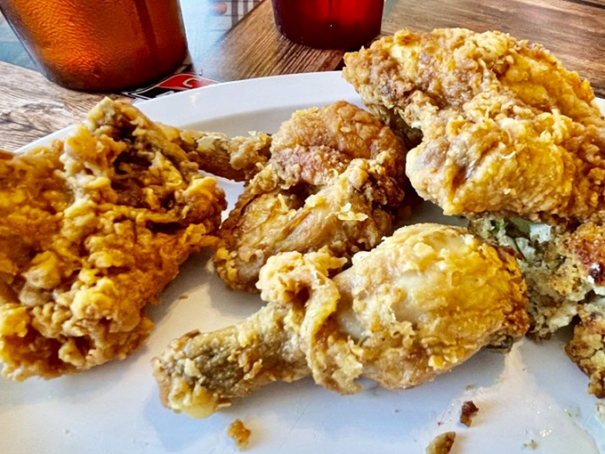Fried chicken with a crust so perfectly seasoned and crispy, it makes you want to start a support group for people who can't stop thinking about it.