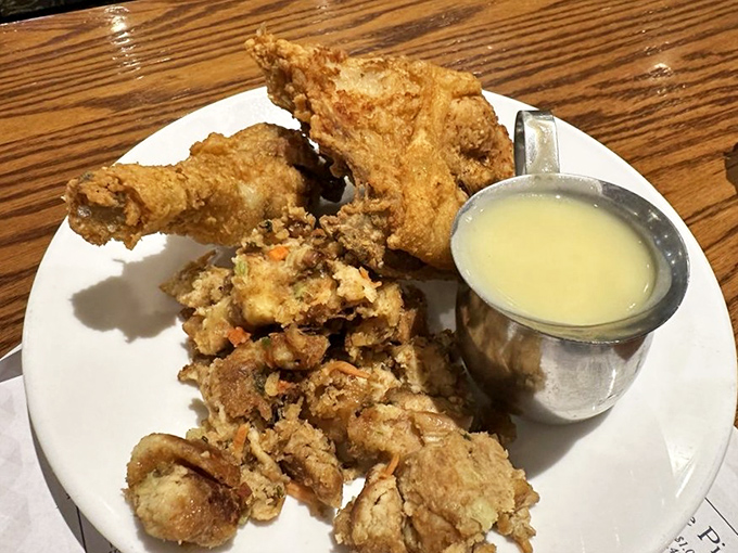 Fried chicken with skin so perfectly crisp it practically shatters on contact, served with gravy that could make a vegetarian question their life choices.