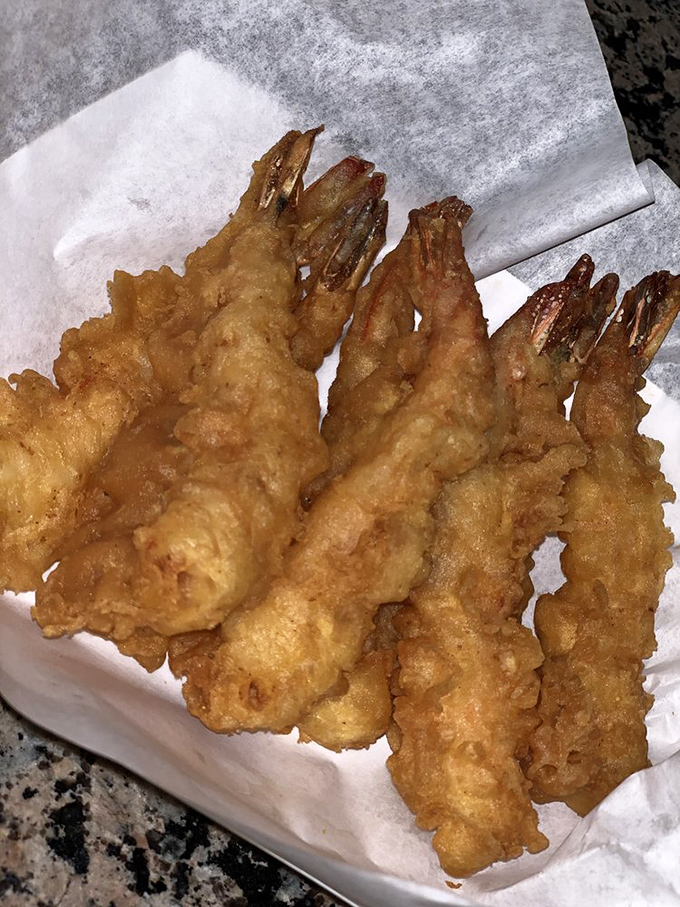 Prawns wearing golden jackets so perfectly fitted they could walk the red carpet, if seafood had award shows for best-dressed appetizer.