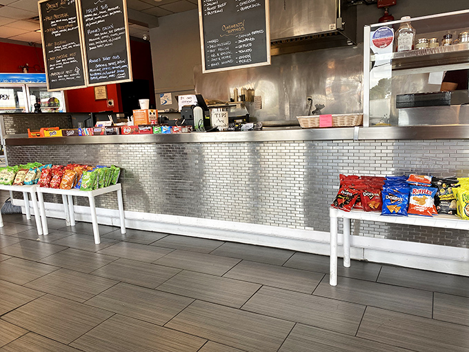 The counter where sandwich dreams become reality. That metallic shine isn't just for show—it's the gleam of culinary promise.