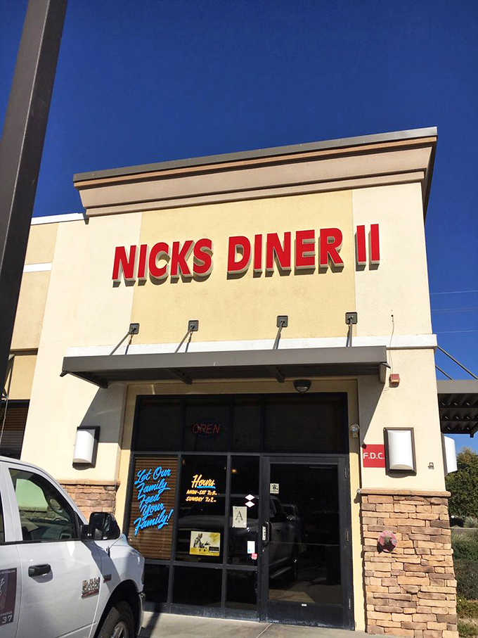 The bright red signage against the desert sky serves as a lighthouse for the breakfast-hungry masses navigating suburban Surprise.