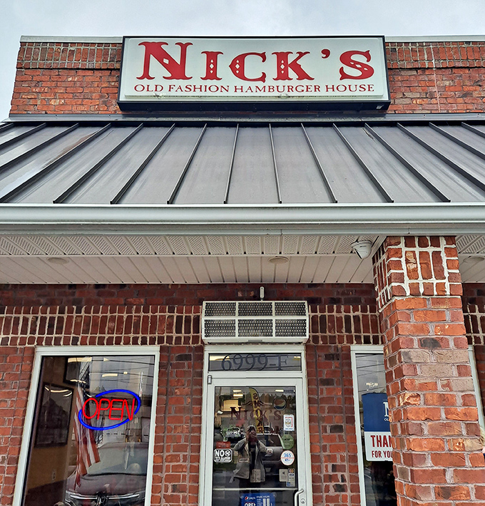 That "OPEN" sign might as well say "Welcome Home" – the brick and metal exterior promises no-nonsense deliciousness within.