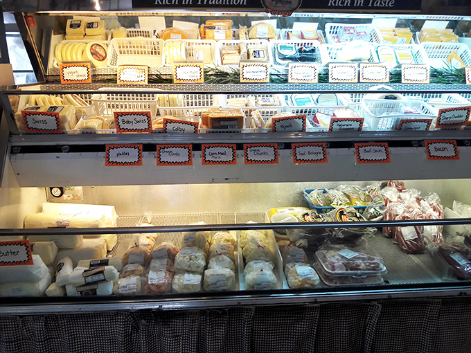 Cheese display that proves heaven might actually be refrigerated. Each variety patiently waits to elevate your next sandwich from lunch to experience.
