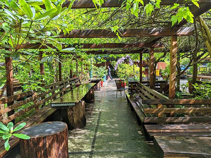 This shaded seating area offers a peaceful respite after having your perception thoroughly scrambled – mental recalibration has never been so serene.
