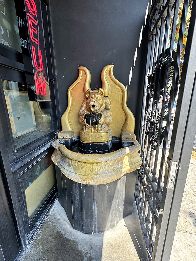 This gargoyle fountain greets visitors with a grimace, setting the tone for the experience ahead. Even the water features lean into the gothic aesthetic.