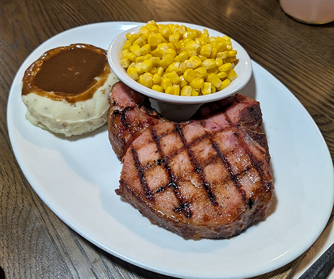 This perfectly grilled pork chop with its crosshatch marks proves that geometry class finally has a delicious real-world application.