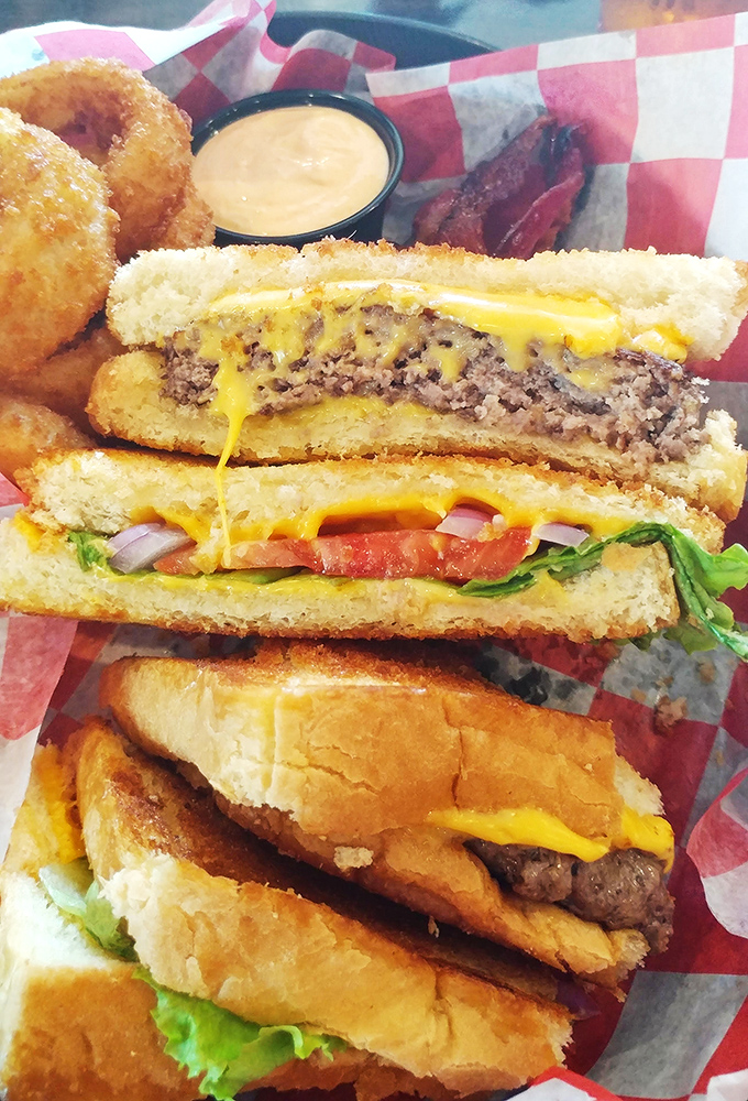 This towering sandwich masterpiece proves that sometimes more is definitely more, especially when hunger calls for serious satisfaction.