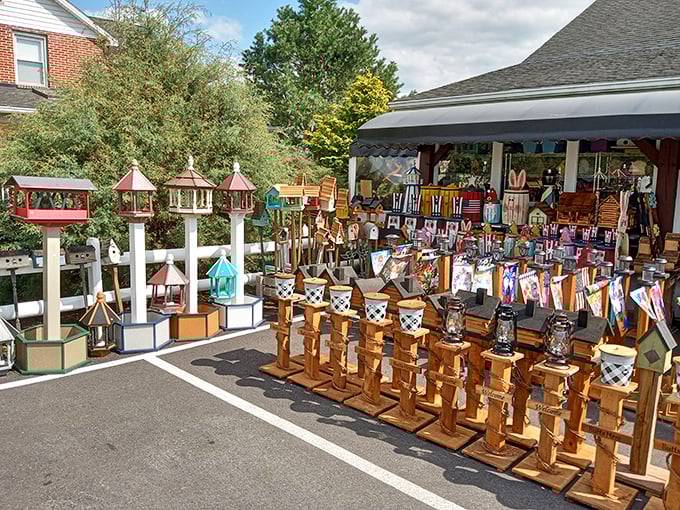 Handcrafted birdhouses and lanterns stand like a miniature village waiting to be adopted. Functional art that brings a touch of Amish craftsmanship home.