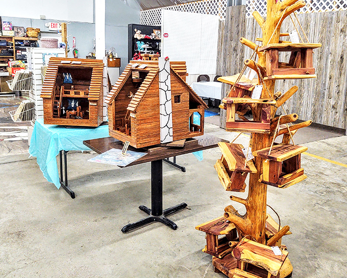 Whimsical wooden birdhouses and folk art creations showcase Ozark craftsmanship. Even the birds deserve real estate with character and handmade charm.