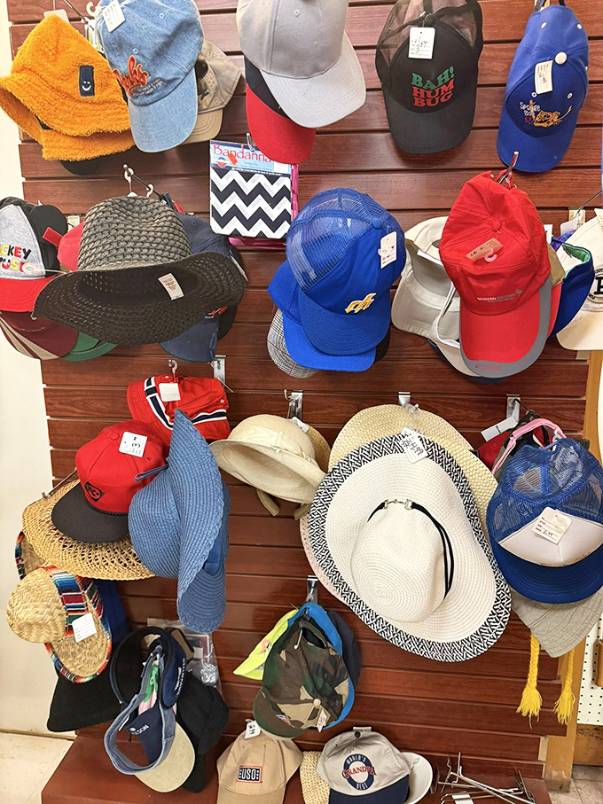 The hat wall: where you can try on new personalities for the price of a coffee. That straw sunhat is practically begging for a beach vacation.