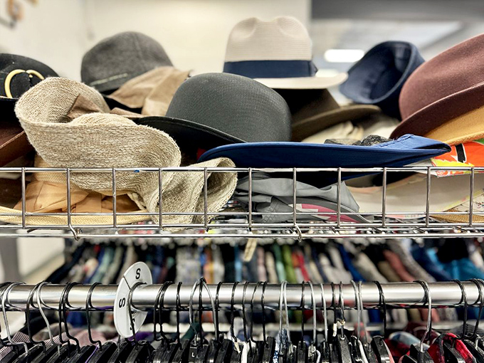 Hats pile high like a milliner's fever dream, waiting to crown the next lucky shopper.