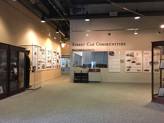 The "Street Car Communities" exhibit space invites visitors to explore how these vehicles shaped American cities. Notice the elegant display cases lining the walls!