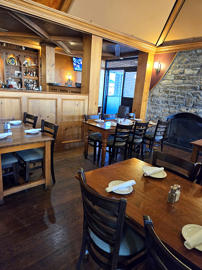 Cozy corners and stone accents create the perfect backdrop for memorable meals. That fireplace promises warmth beyond just the temperature.